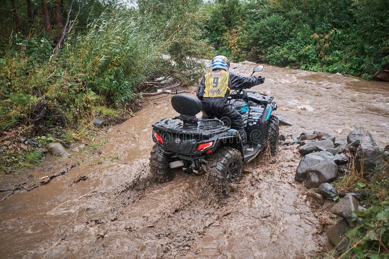 Quad Rider Jumping on a Muddy Forest Trail Editorial Photography ...
