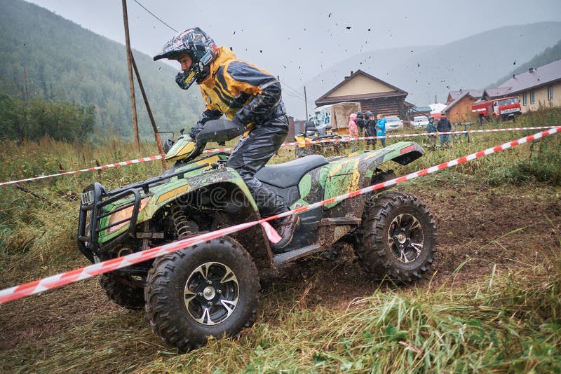Quad Rider Jumping on a Muddy Forest Trail Editorial Photography ...