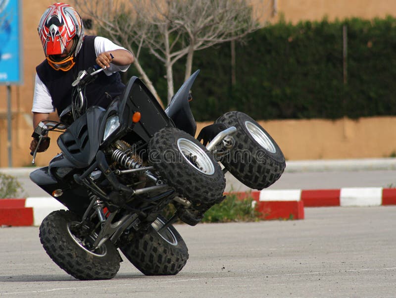 Speeding Quad in Sand Dunes Stock Photo - Image of coast, angle: 14179988