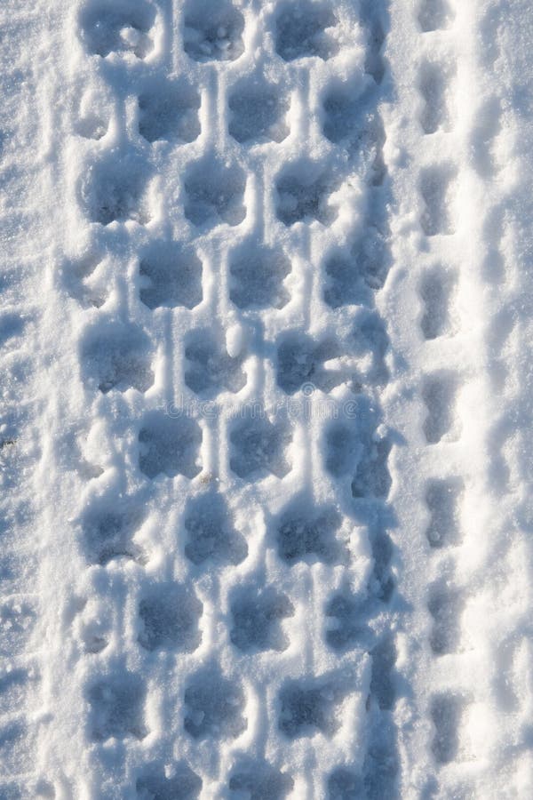 Quad tire tracks on snow stock image. Image of texture - 209126961