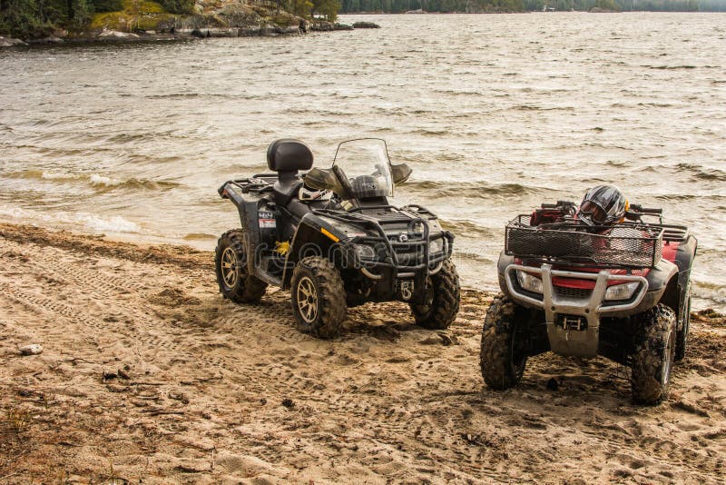 Quading by the lake editorial photo. Image of honda, lake - 68406241