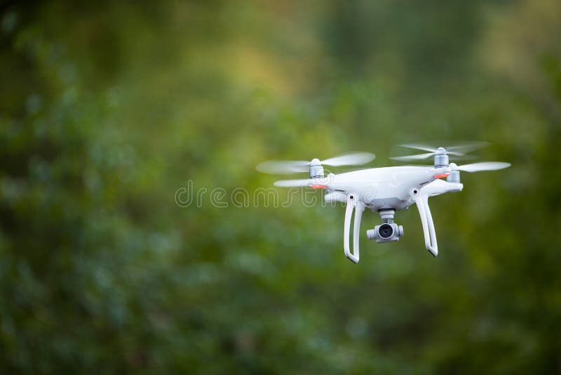 Quadrocopter Drone in Flight Stock Photo - Image of airplane, lens ...