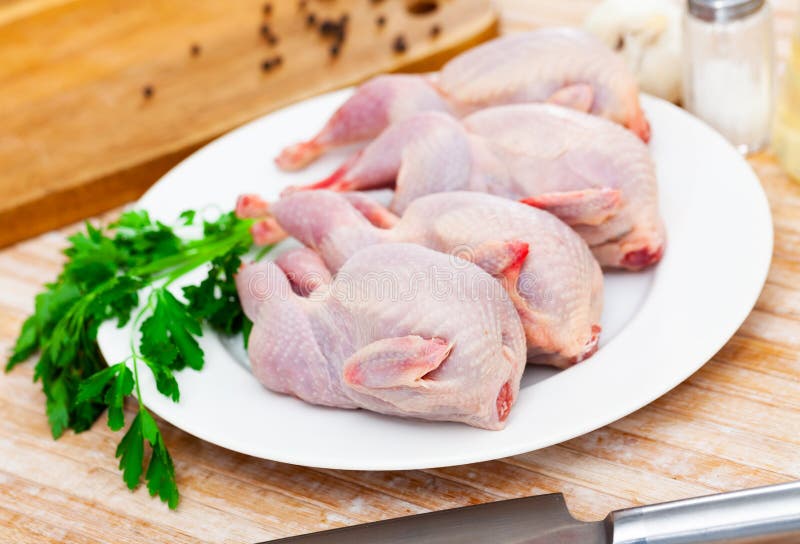 Quail Carcasses Lie on Cutting Board. Small Birds are Prepared for ...