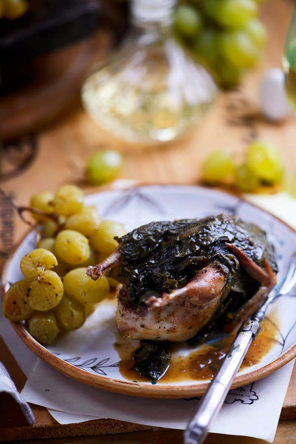Quail in Grape Leaves with Grapes.style Vintage Stock Image - Image of ...