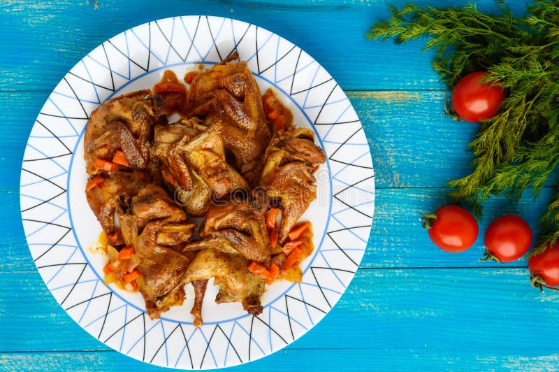 Quail Stew with Vegetable Gravy on a Blue Wooden Table. Stock Image ...