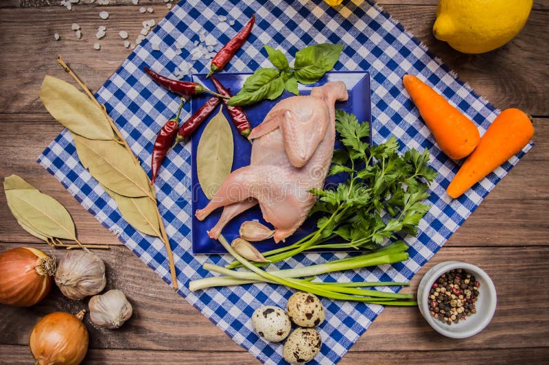 Quail on a Wooden Board and Spices. Top View. Close-up Stock Photo ...