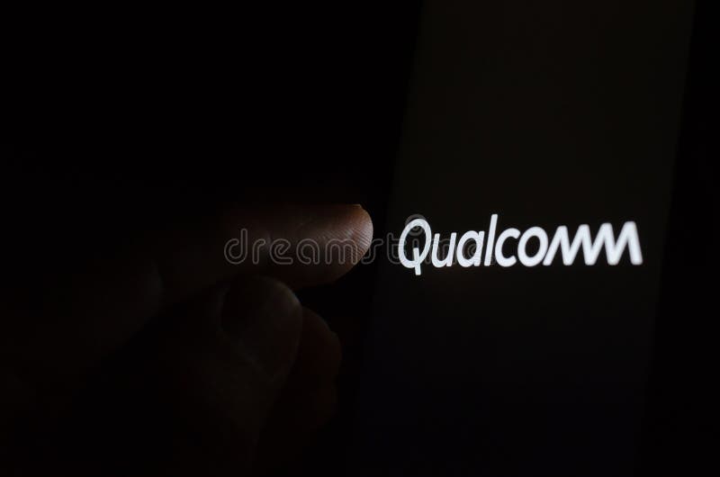 Qualcomm Chip Design Company Logo on a Glowing Screen and a Hand ...