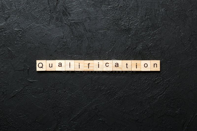Qualification Word Written on Wood Block. Qualification Text on Table ...