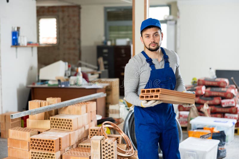Builder Holds Red Brick Construction Material in His Hands Stock Image ...