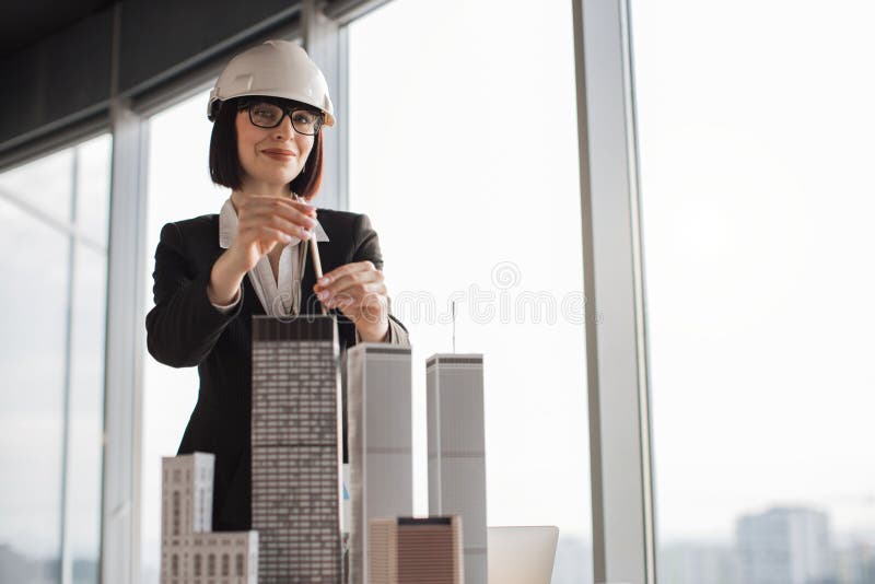 Qualified Female Architect, Engineer in Suit and Hard Hat Measuring ...