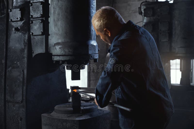 Qualified Forge Worker in Overalls Hitting Molten Metal Stock Photo ...