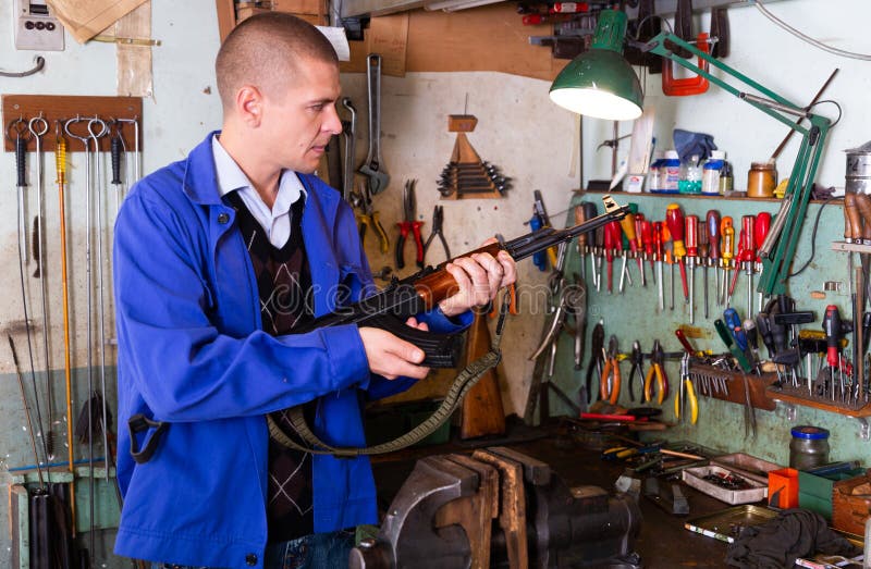 Gunsmith Performing Maintenance of Kalashnikov Assault Rifle in ...