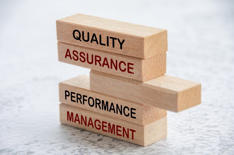 Quality Assurance and Performance Management Text on Wooden Blocks ...