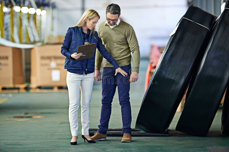 Quality Check. a Two Coworkers Managing a Warehouse. Stock Photo ...