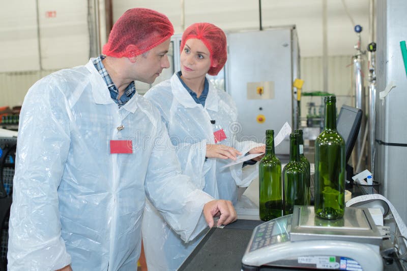 Quality Control Bottles Against Bright Light Stock Photo - Image of ...