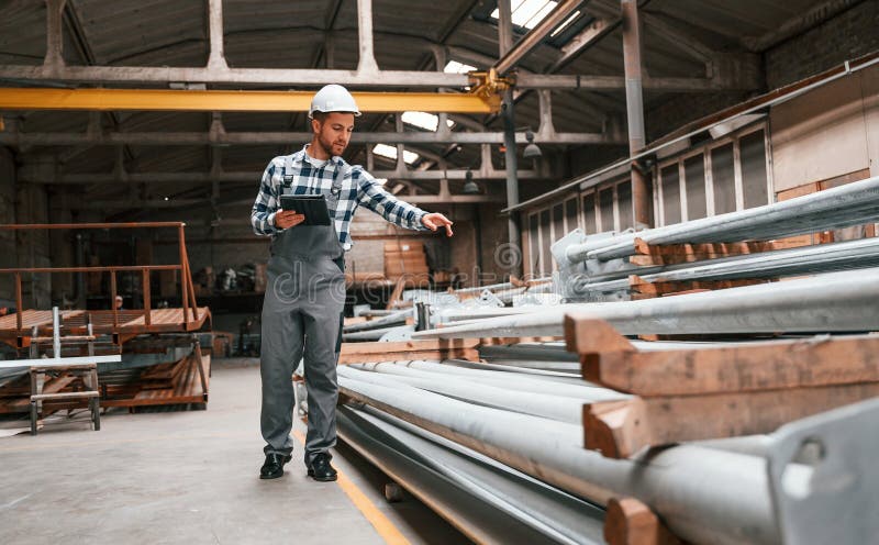 Quality Control. Factory Male Worker in Uniform is Indoors Stock Image ...