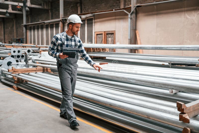 Quality Control. Factory Male Worker in Uniform is Indoors Stock Image ...