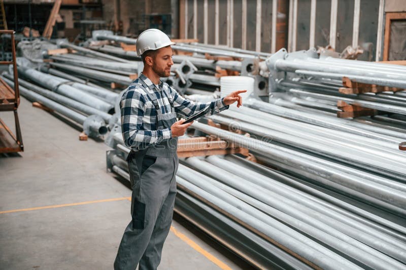 Quality Control. Factory Male Worker in Uniform is Indoors Stock Image ...