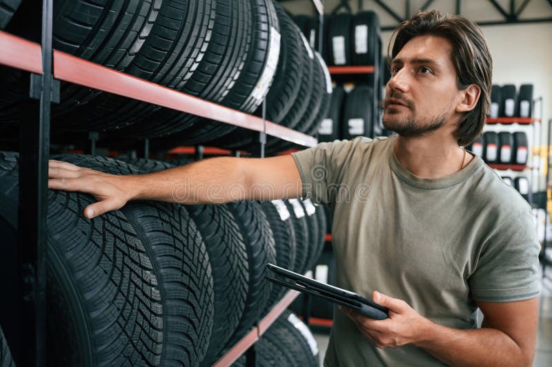 Quality Control, Manager is Looking for Stuff. Man is in the Tire ...