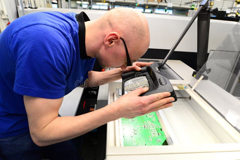 Quality Control in the Production - Man Checks Board for Defects Stock ...