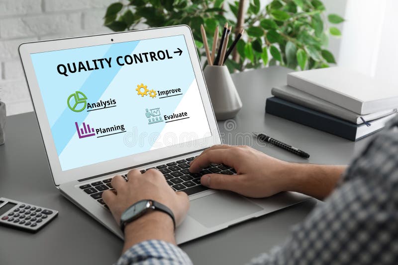 Quality Control Service. Man Using Laptop at Table Stock Photo - Image ...
