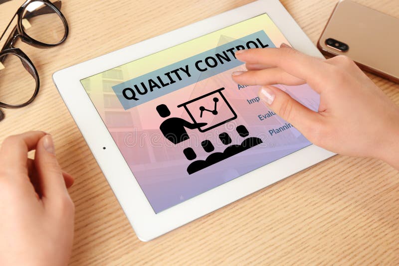 Quality Control Service. Woman Using Tablet Computer at Desk Stock ...