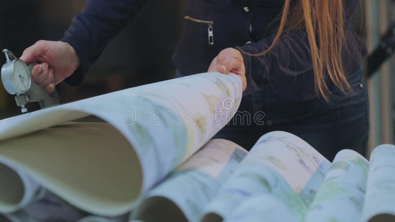 Quality Control of Wallpaper in a Factory, Checking the Thickness of ...