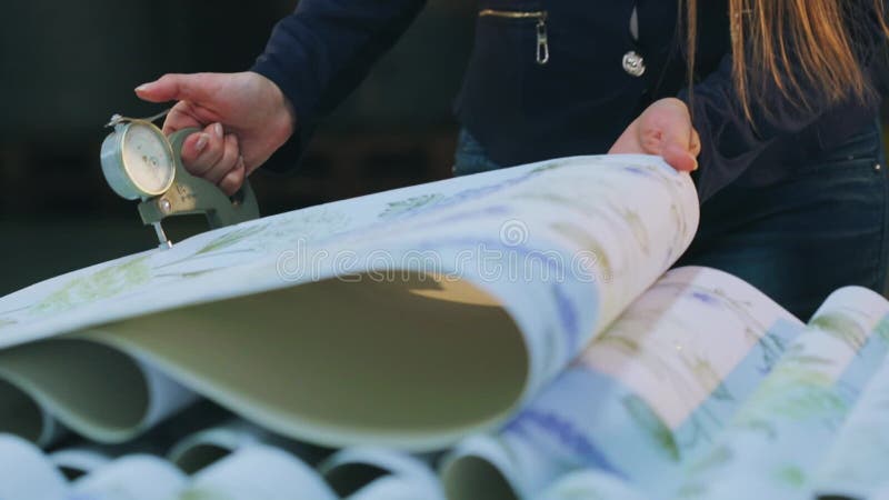 Quality Control of Wallpaper in a Factory, Checking the Thickness of ...