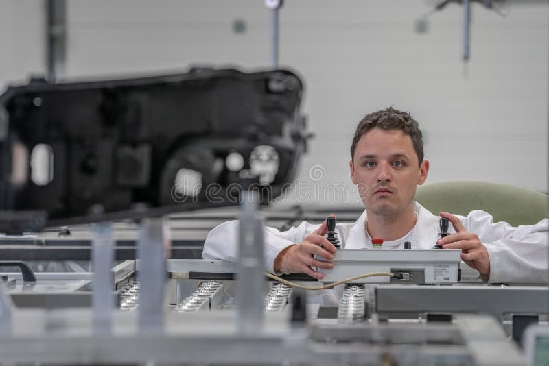 Engineer Performs Maintenance of Industrial Robot in a Factory Stock ... Engineer Performs Maintenance of Industrial Robot in a Factory Stock ...