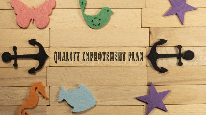 Quality Improvement Plan Written on Wooden Surface. Education and Child ...