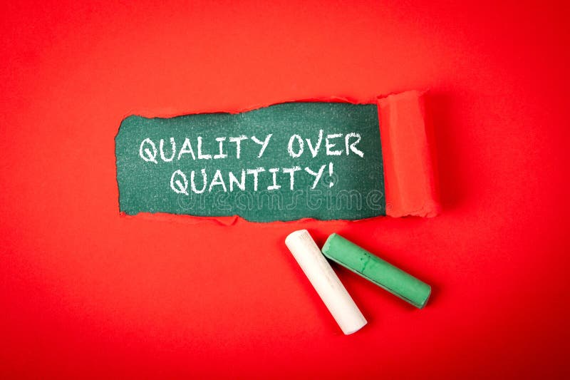 Quality Over Quantity. Text Under Torn Red Paper on a Green Chalkboard ...
