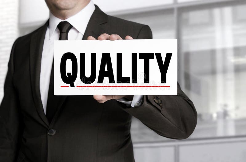 Quality Sign is Held by Businessman Stock Image - Image of sign, space ...