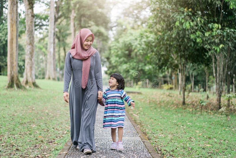 Quality Time Veiled Mother with Little Daughter Go To Park Stock Image ... Quality Time Veiled Mother with Little Daughter Go To Park Stock Image ...