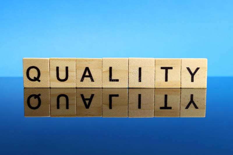 Quality of Word on Wooden Blocks on a Mirror Table Stock Image - Image ...