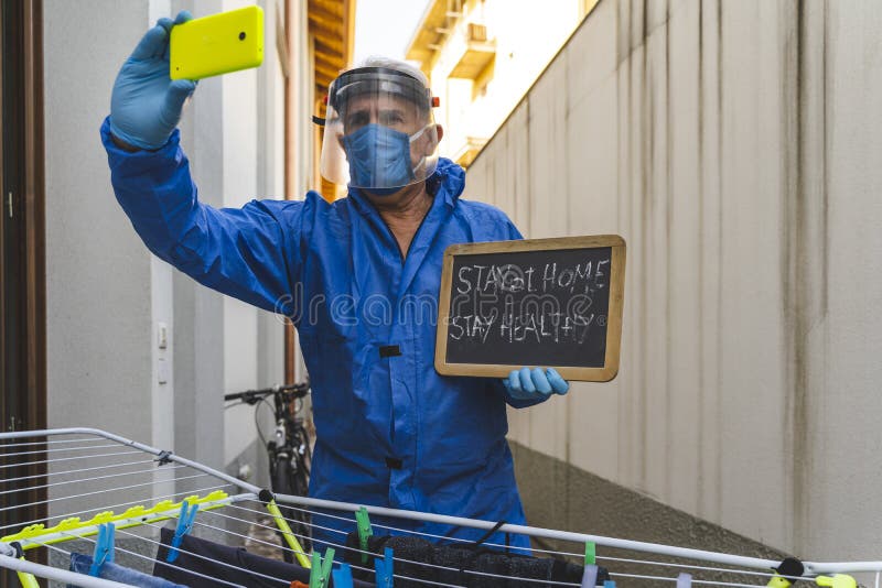 Quarantined Single Man Dressed in Protective Suit is Taking a Selfie ...