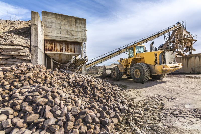 Quarry Aggregate with Heavy Duty Machinery. Caterpillar Loader ...
