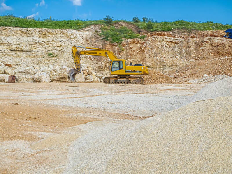 Limestone Stone Quary and an Excavator. Stock Photo - Image of names ...
