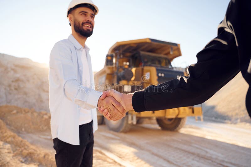 Quarry Worker Making a Deal with Colleague. Shaking Hands Stock Image ...