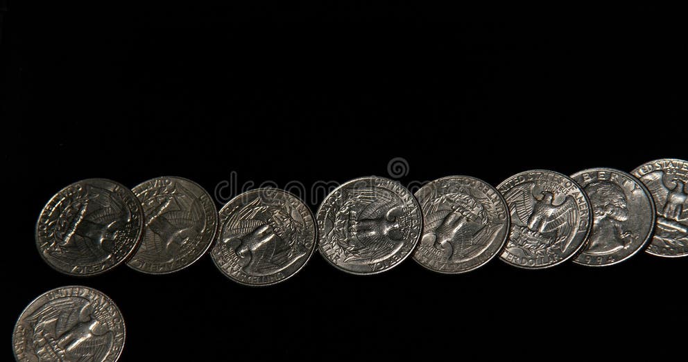 Quarter Dollar Coins Falling, Rolling and Sliding on Black Background ...