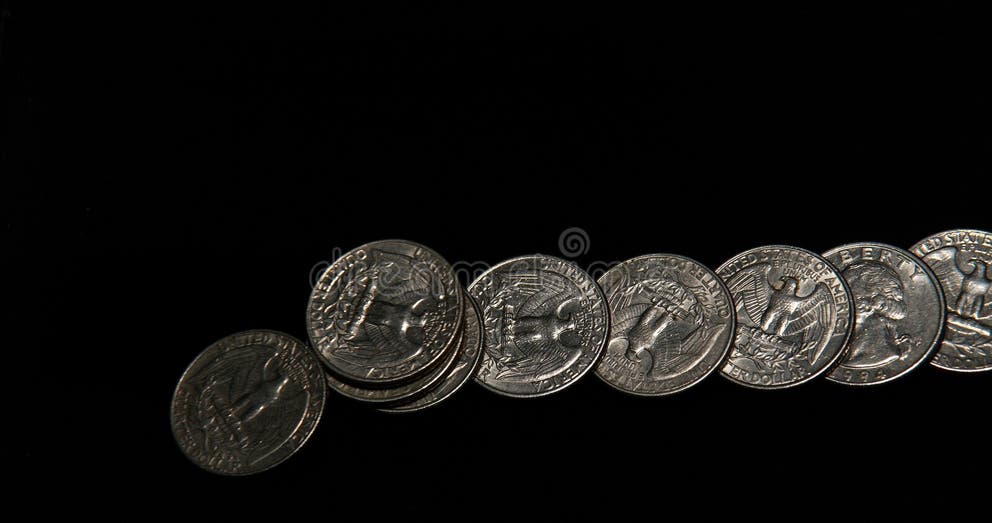 Quarter Dollar Coins Falling, Rolling and Sliding on Black Background ...