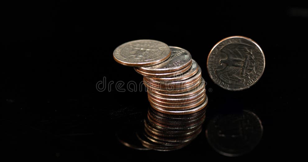 Quarter Dollar Coins Falling, Rolling and Sliding on Black Background ...