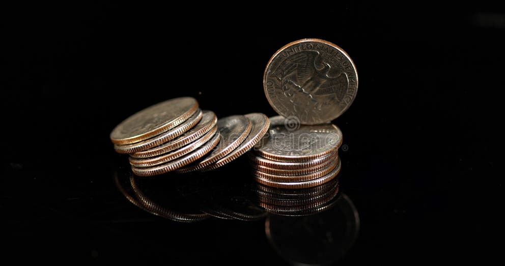 Quarter Dollar Coins Falling, Rolling and Sliding on Black Background ...