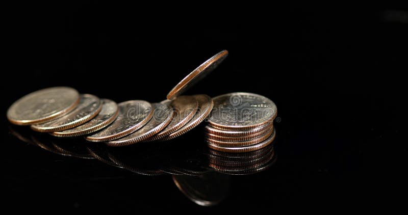 Quarter Dollar Coins Falling, Rolling and Sliding on Black Background ...