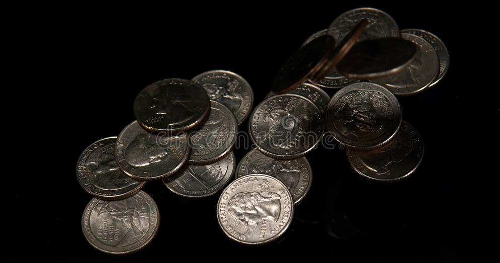 Quarter Dollar Coins Falling, Rolling and Sliding on Black Background ...