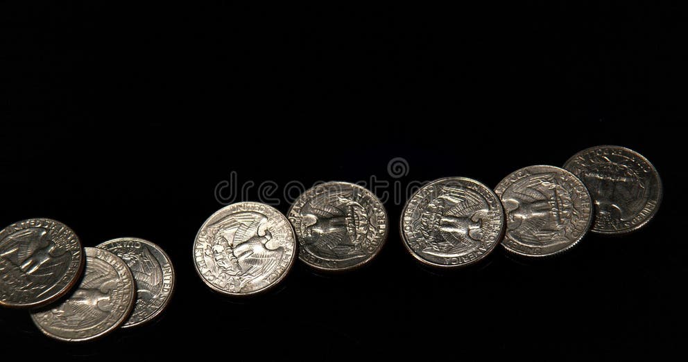 Quarter Dollar Coins Falling, Rolling and Sliding on Black Background ...