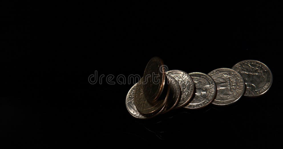 Quarter Dollar Coins Falling, Rolling and Sliding on Black Background ...
