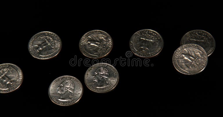 Quarter Dollar Coins Falling, Rolling and Sliding on Black Background ...