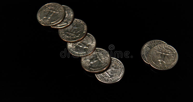 Quarter Dollar Coins Falling, Rolling and Sliding on Black Background ...