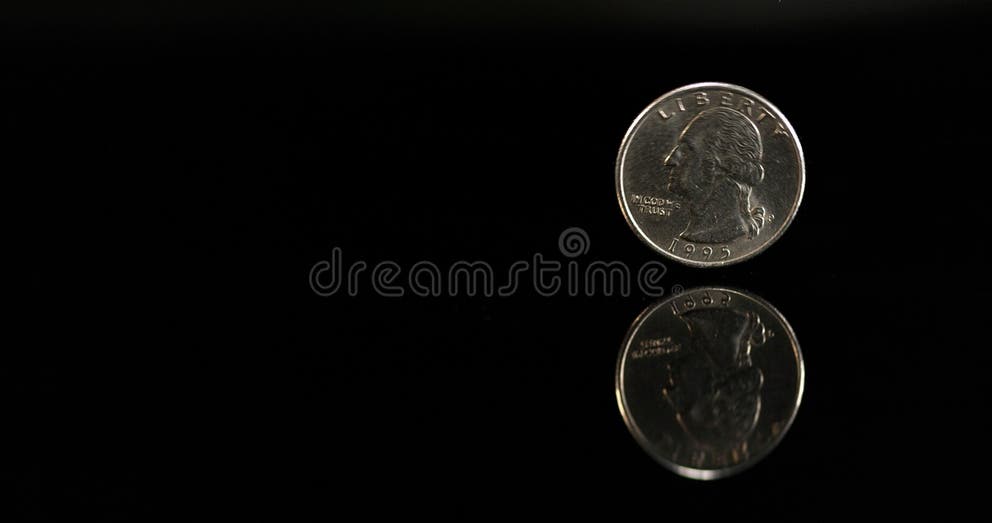 Quarter Dollar Coins Falling, Rolling and Sliding on Black Background ...