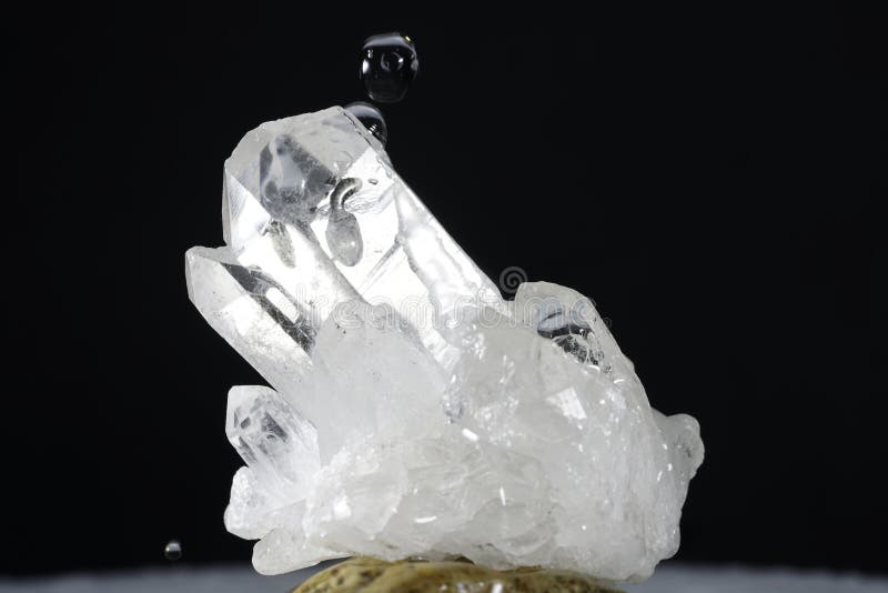 Quartz with Mineral Crystals Against a Black Background Stock Image ...